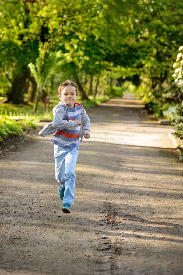 Little Boy Running in the Park. Stock Image - Image of people ...