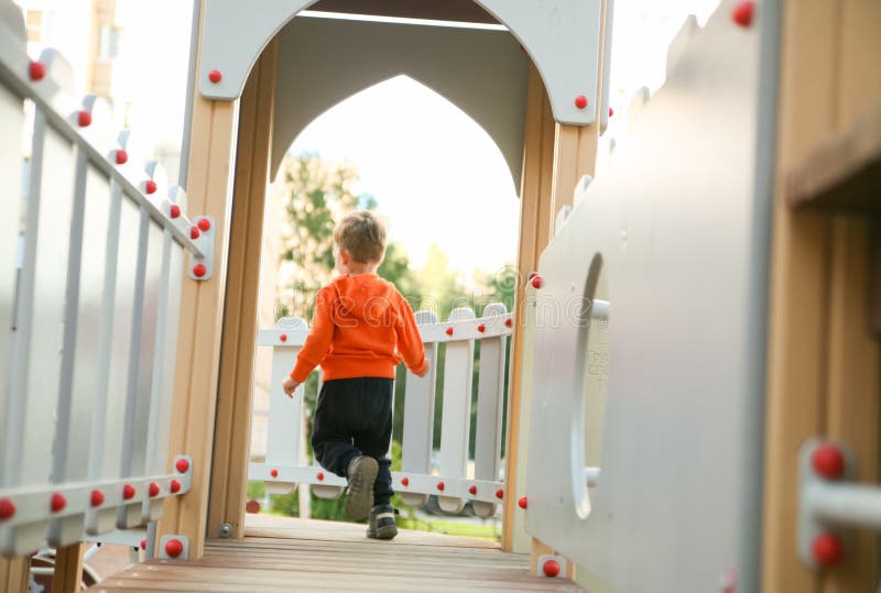 Little Boy Running on the Playground Stock Image - Image of blond ...