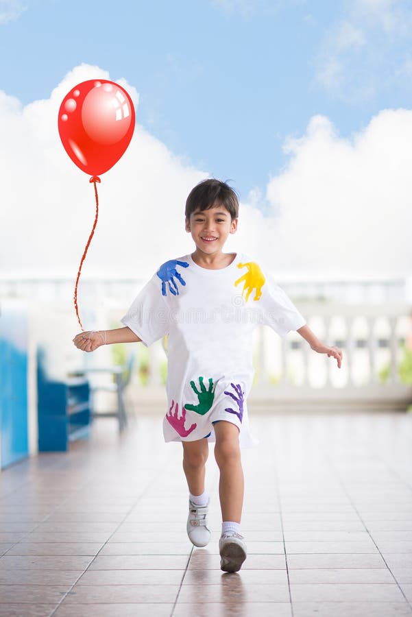 Little Boy Running at School with Happy Face Taking a Red Balloon in ...