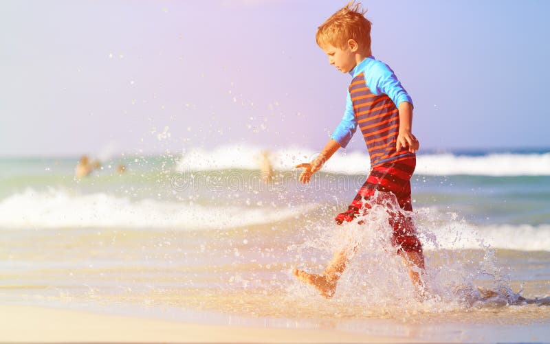 Little Boy Running Splashing Water on Beach Stock Image - Image of ...