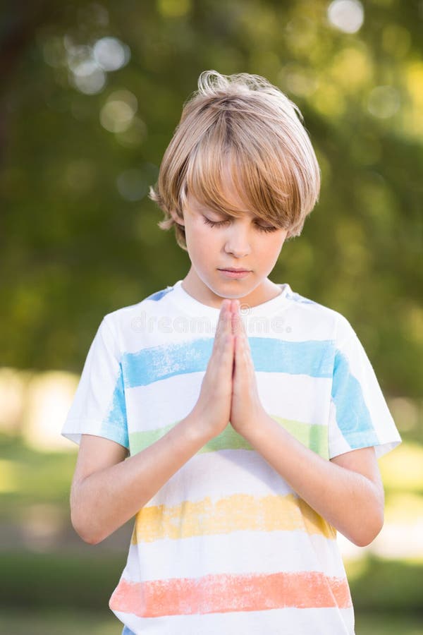 Little Boy Praying With Bowed Head Stock Image - Image of short, tshirt ...