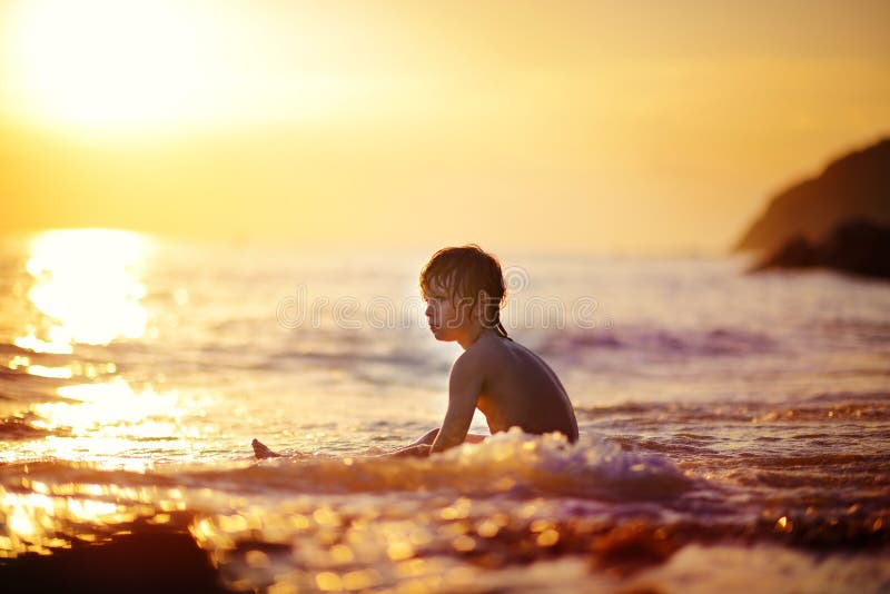 Little Boy on a Seashore at Sunset Stock Photo - Image of seaside ...