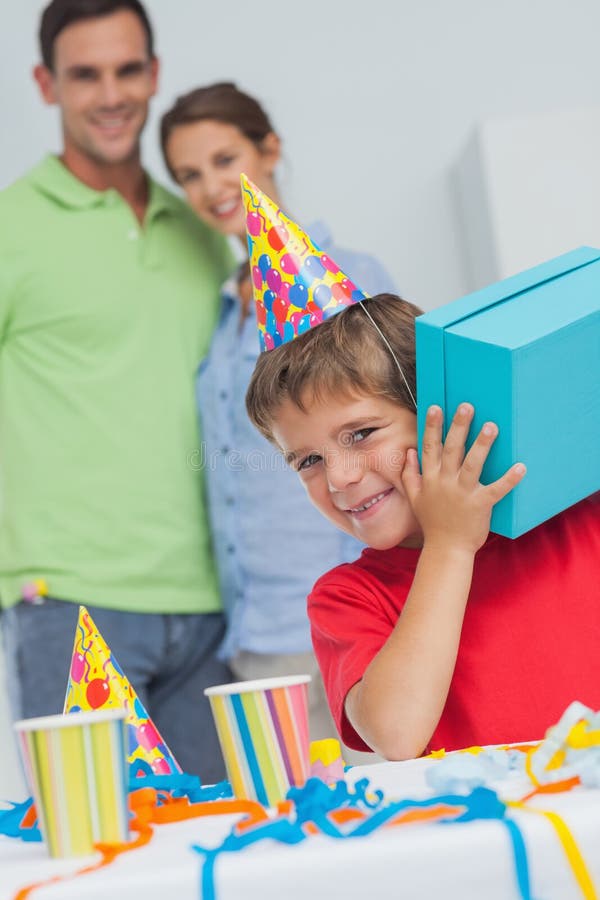Little Boy Shaking His Birthday Gift Stock Image - Image of child ...