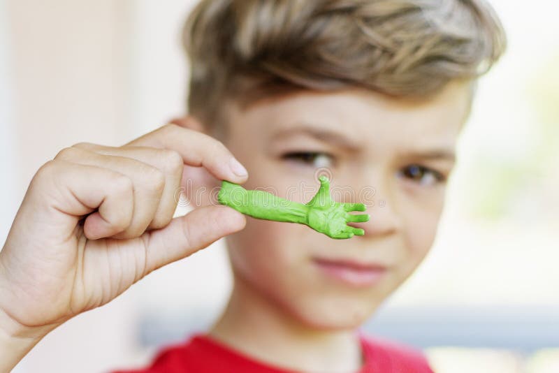 A Little Boy Shows a Craft Made of Plasticine Stock Image - Image of ...
