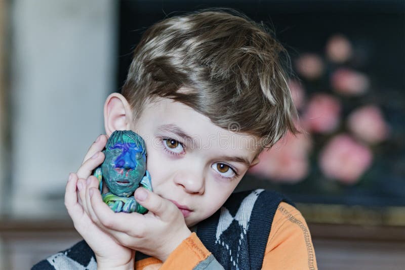 A Little Boy Shows a Craft Made of Plasticine Stock Image - Image of ...