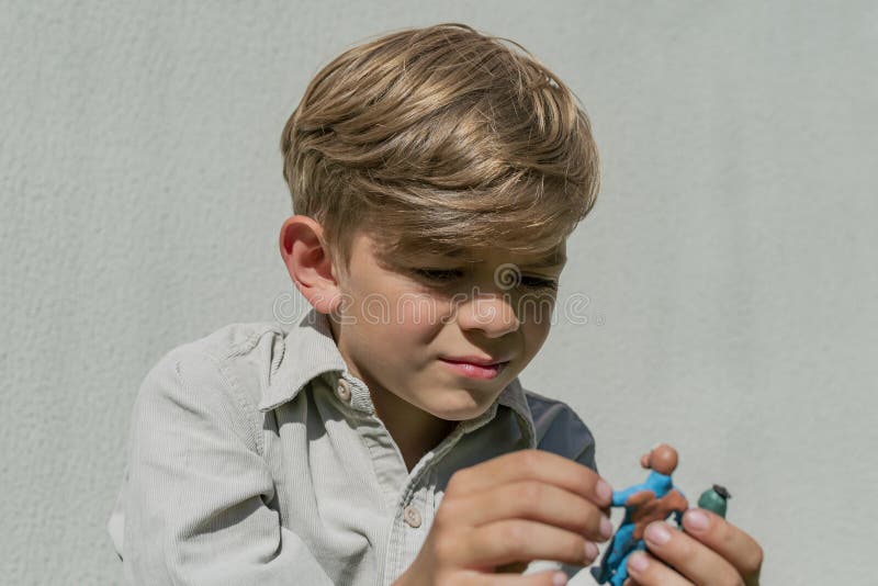 A Little Boy Shows His Plasticine Crafts Stock Image - Image of child ...
