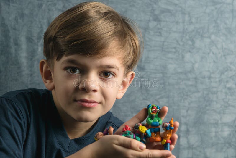 Little Boy Shows Off His Plasticine Crafts Stock Image - Image of ...