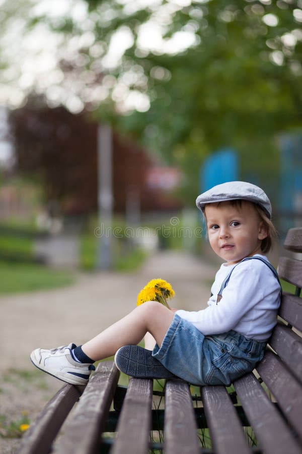 Little Boy, Sitting on a Bench Stock Image - Image of beautiful ...