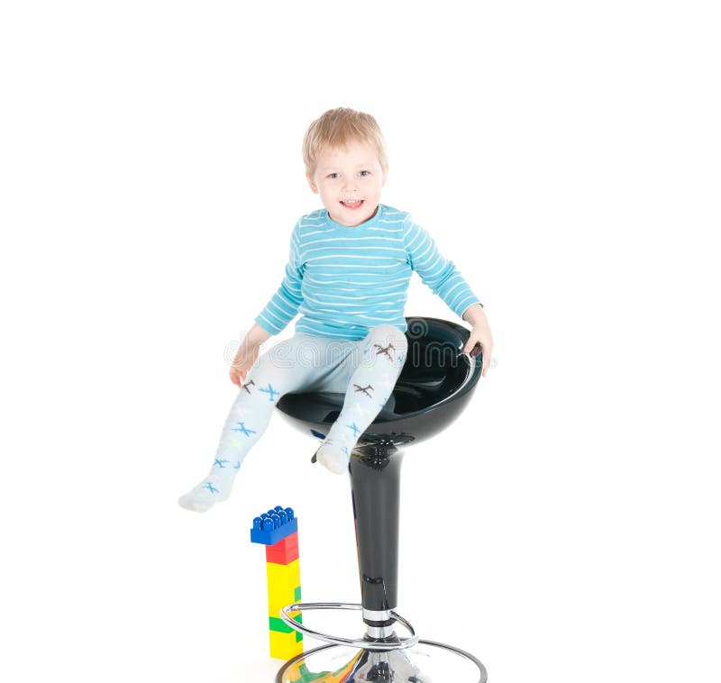 Little Boy Sitting in a Chair Stock Image - Image of male, beautiful ...