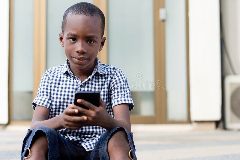 Child using mobile phone stock photo. Image of elementary - 115280870