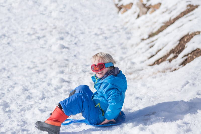 Little Boy Sitting on Sled and Smiling Stock Image - Image of ...