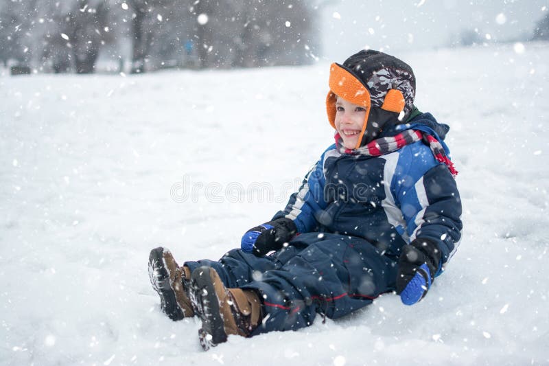 Little Boy Sitting in Snow. Stock Photo - Image of beautiful, sitting ...
