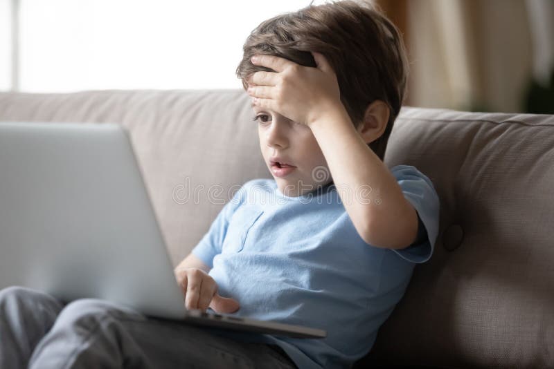 Little Boy Hocked by Inappropriate Content, Looking at Computer Screen ...