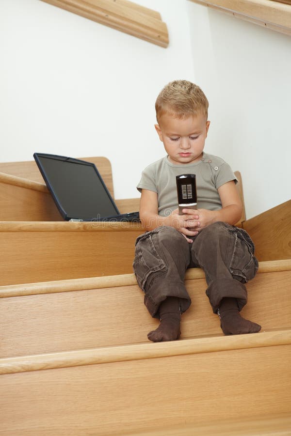 Little Boy Sitting on Stairs Stock Image - Image of home, male: 12412915