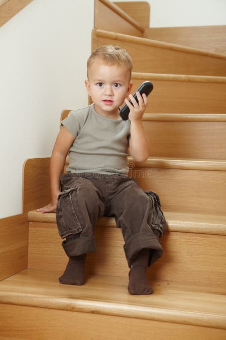 Little Boy Sitting on Stairs Stock Image - Image of carefree, face ...