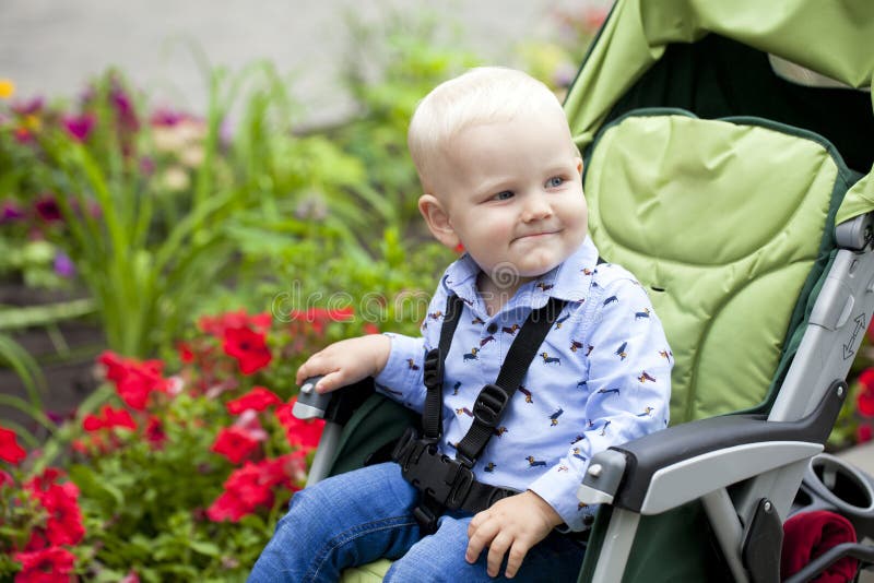 Little Boy Sitting in Stroller Stock Image - Image of buggy, smiling ...