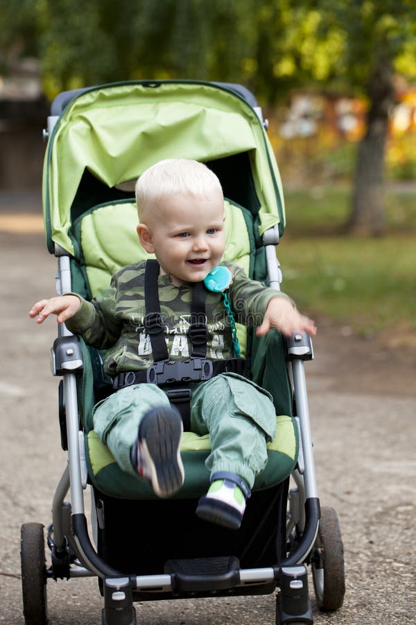 Little Boy Sitting in Stroller Stock Image - Image of stroller, toddler ...