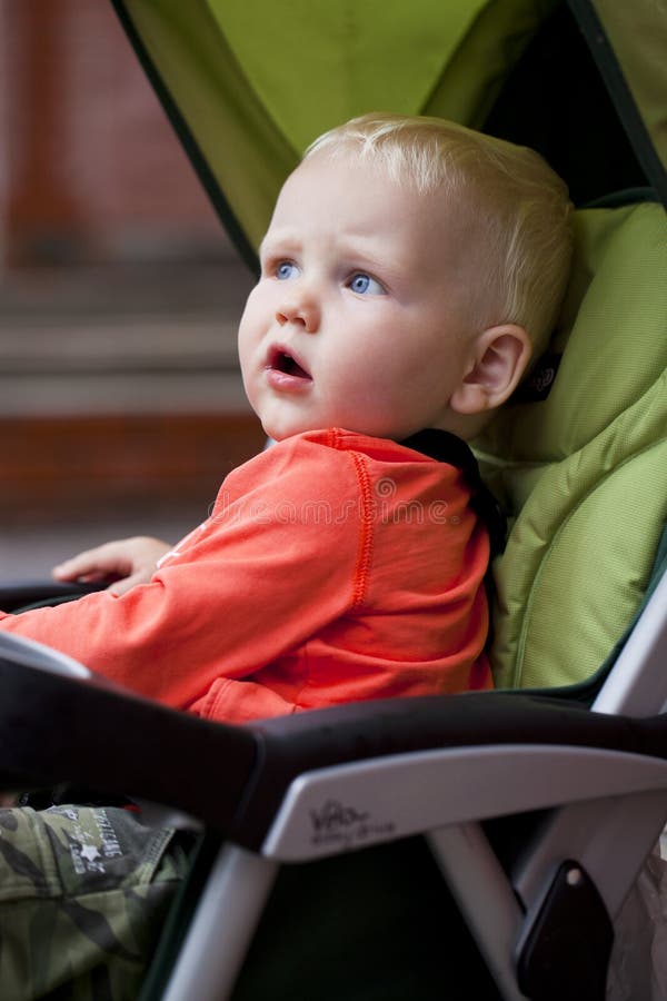 Little Boy Sitting in Stroller Stock Image - Image of transportation ...