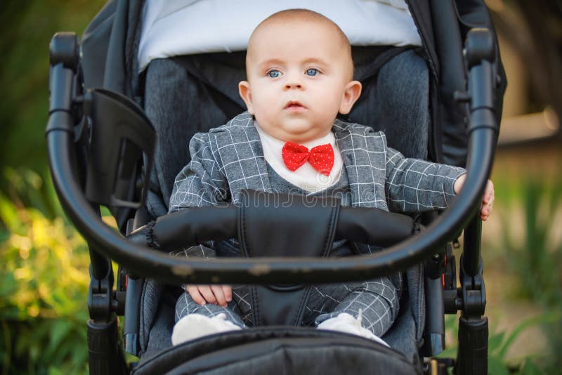 Little Boy Sitting in a Stroller Stock Image - Image of girl, child ...