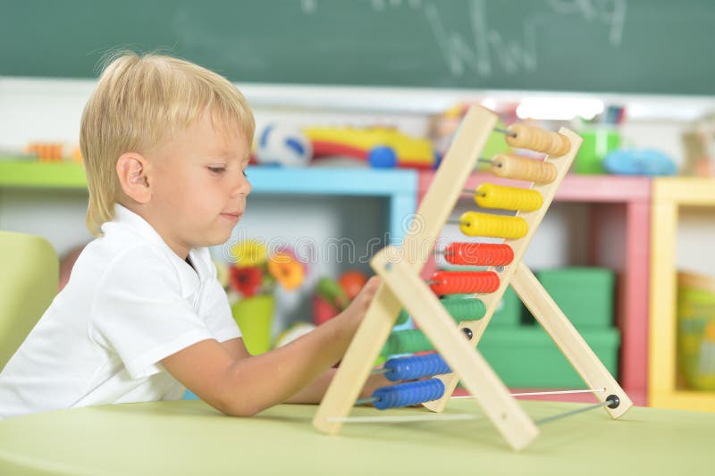 Little Boy Sitting and Learning To Use Abacus Stock Image - Image of ...