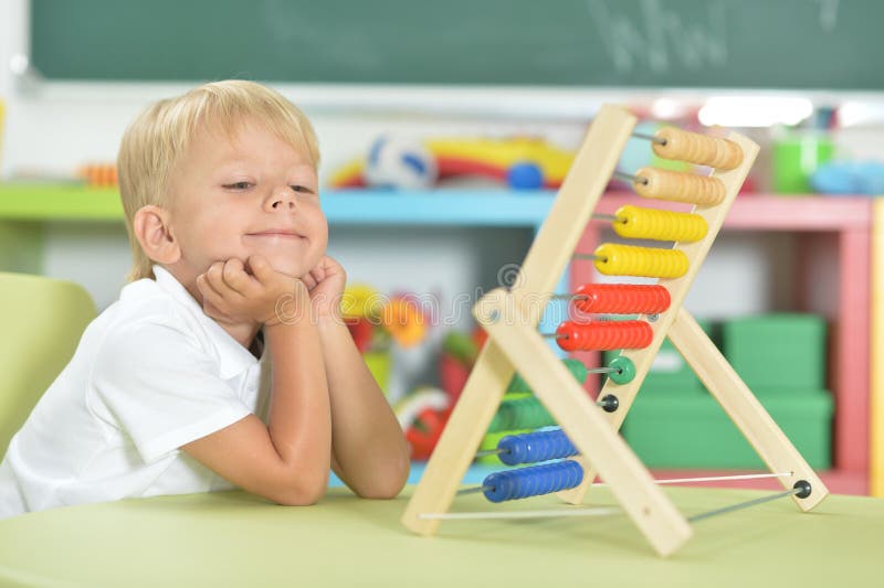 Little Boy Sitting and Learning To Use Abacus Stock Photo - Image of ...
