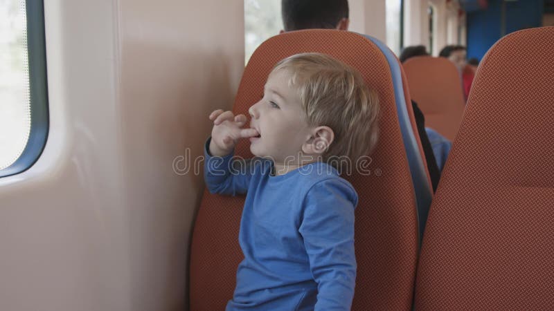 Little Boy Sitting on a Train by the Window Stock Video - Video of trip ...