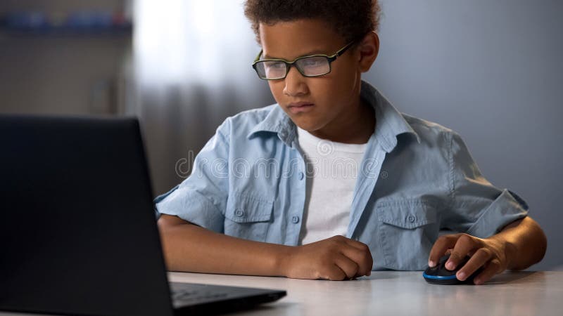 Little Boy Skillfully Using Computer Mouse To Search Information on ...