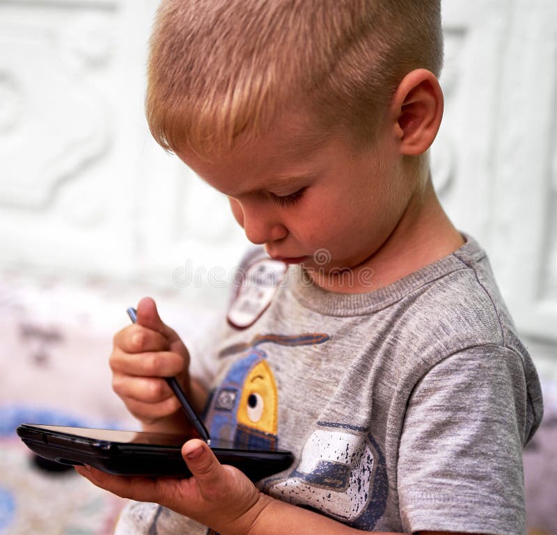 Little boy with smartphone stock image. Image of intelligence - 60124613