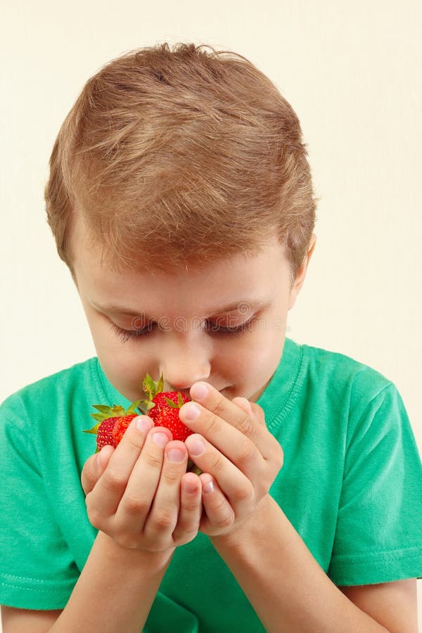 Little Boy Smelling Handful of Fresh Ripe Strawberries Stock Photo ...