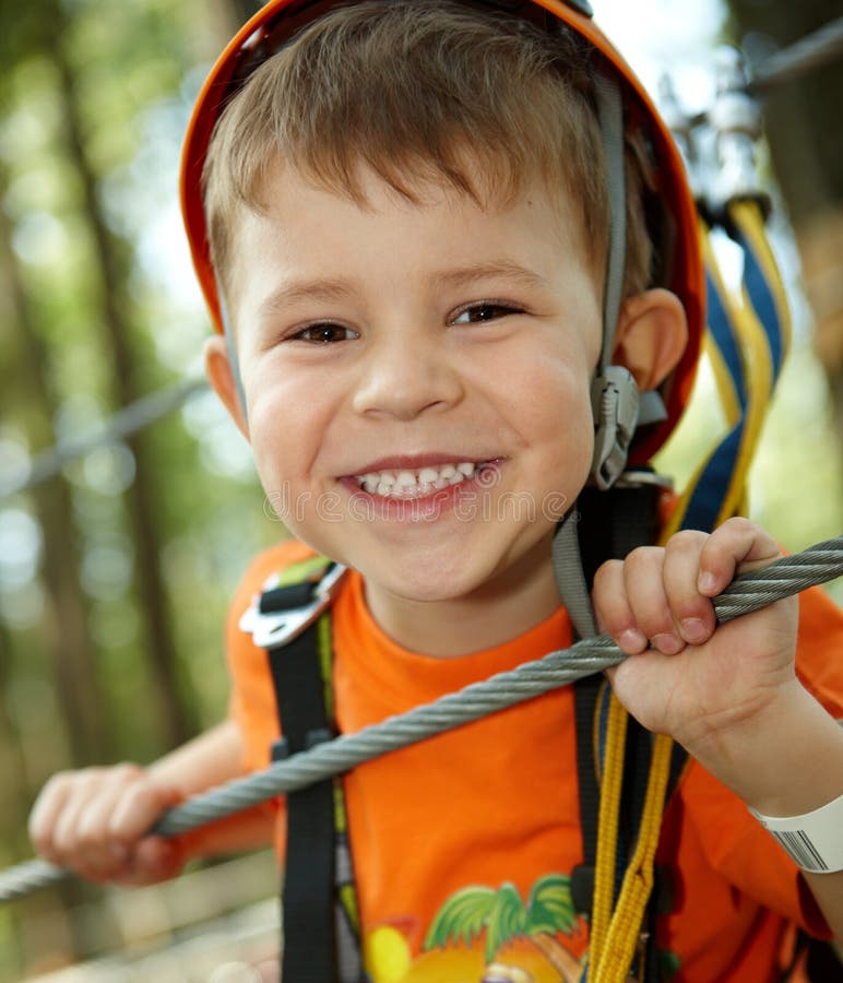 Little Boy Smiling in Adventure Park Stock Photo - Image of hair ...