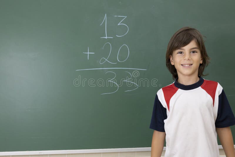 Boy Doing Math Operations on the School Blackboard. Stock Image - Image ...