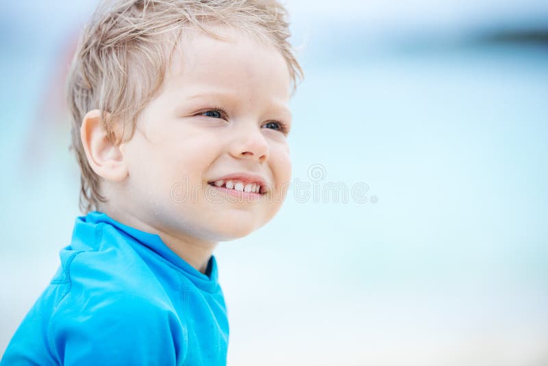 Little Boy Smiling on the Beach Stock Photo - Image of beach, young ...