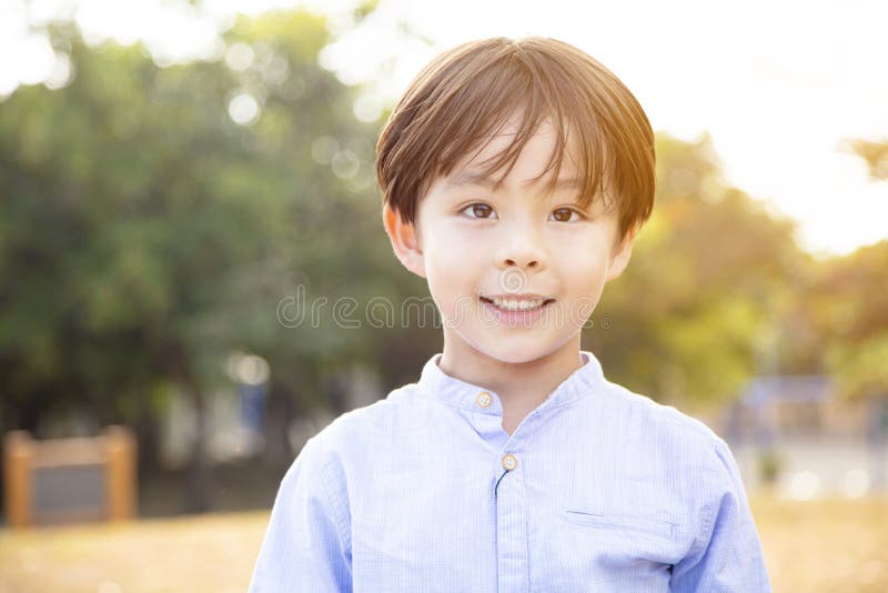 Boy Smiling and Looking at Camera Stock Photo - Image of people ...