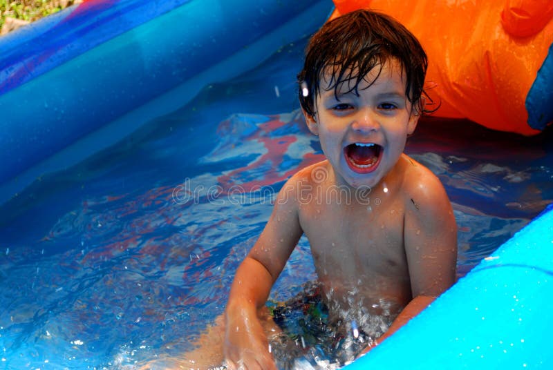 Little Boy Smiling and Splashing in a Pool Stock Image - Image of ...