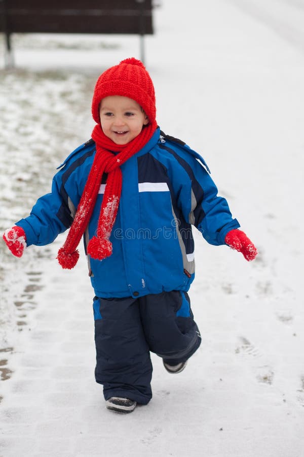 Little boy in the snow stock photo. Image of colors, life - 37528248
