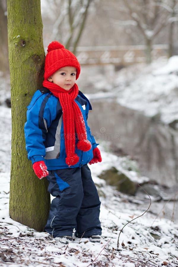 Little boy in the snow stock image. Image of play, scarf - 37528811