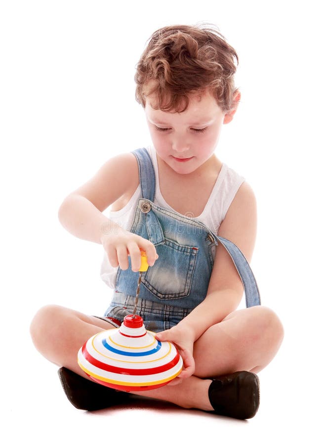 Boy Playing with a Spinning Top Stock Photo - Image of infant, small ...