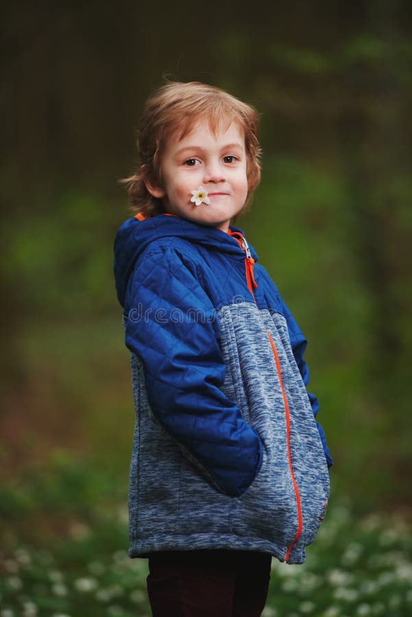 Little Boy in Spring Forest with Many Flowers Stock Image - Image of ...