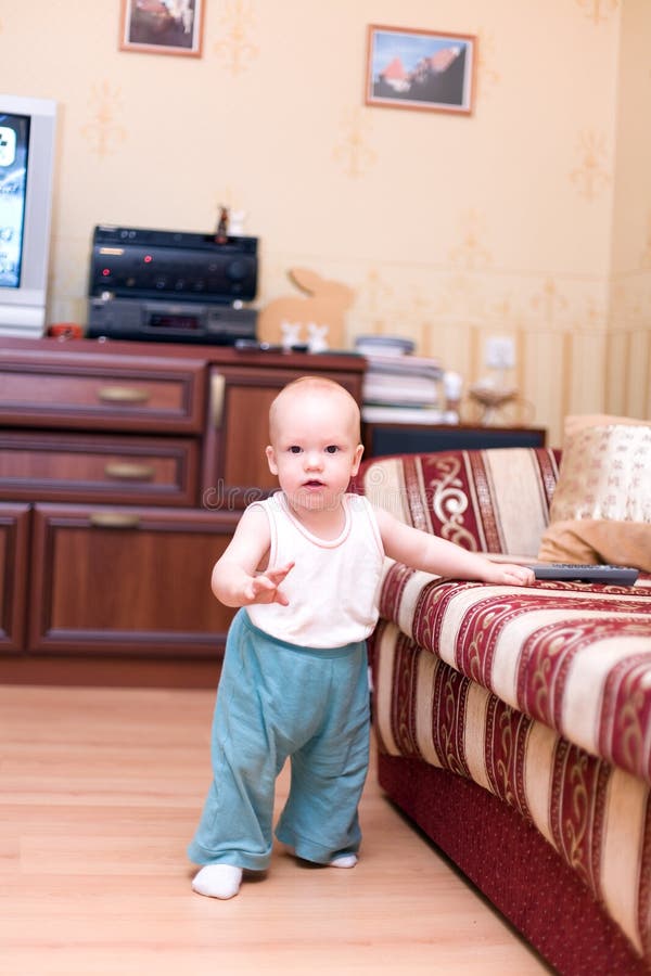 Little Boy Stand on Hardwood Floor in Home Stock Photo - Image of ...