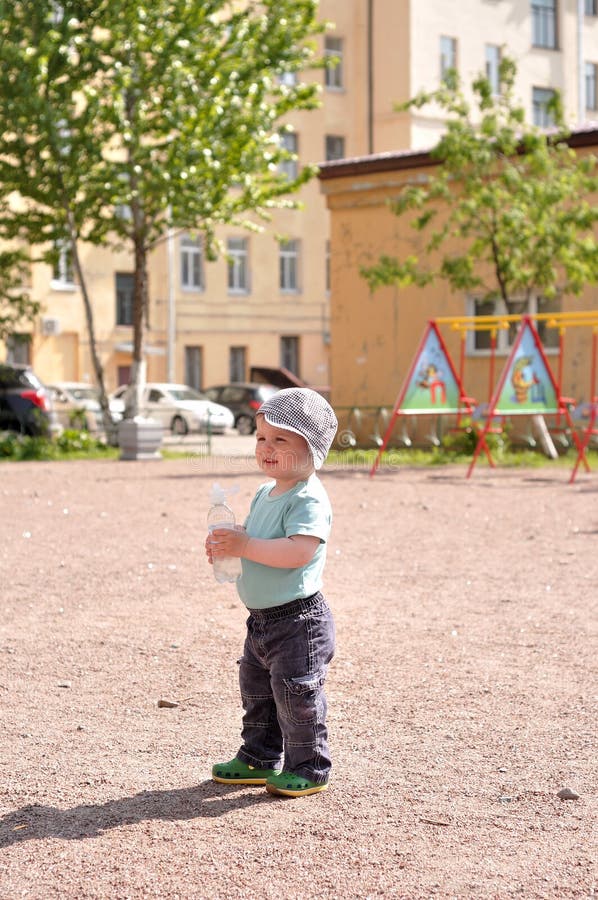 Little Boy Stand with a Water Bottle Stock Photo - Image of cute, human ...