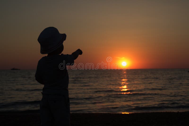 Little Boy Standing Back and Watching the Sunset Stock Photo - Image of ...