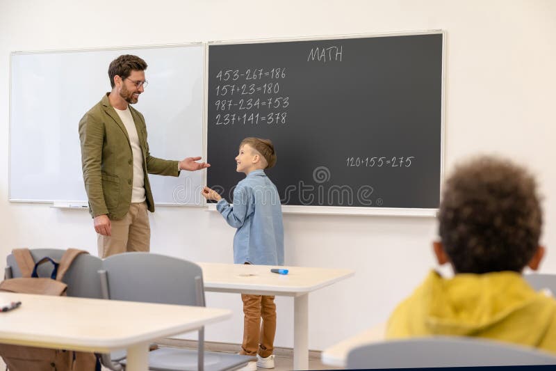 Little Boy Standing in Classroom while Learning Math Lesson with His ...