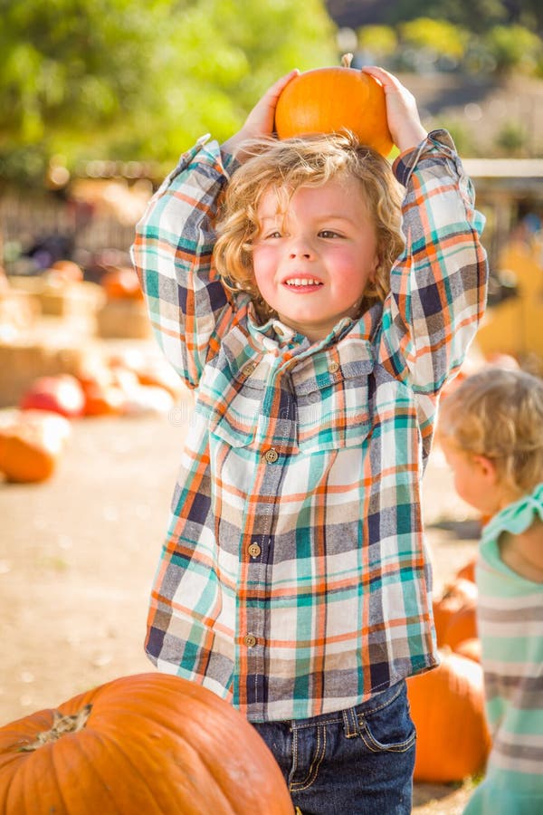 Little Boy Standing in a Rustic Ranch Setting at the Pumpkin Patch ...