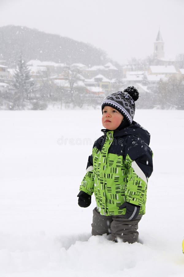 Little Boy Standing in the Snow with Stocking Cap Stock Image - Image ...