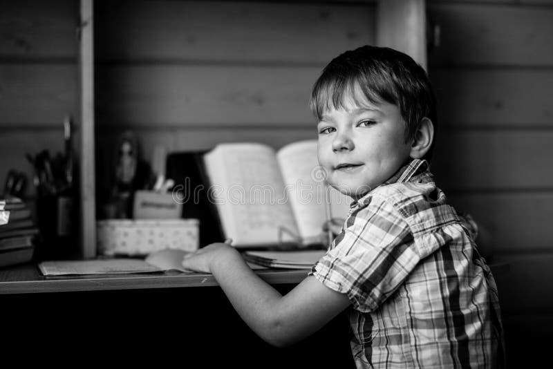 Little Boy Student Doing Homework. Black and White Photo. Stock Photo ...