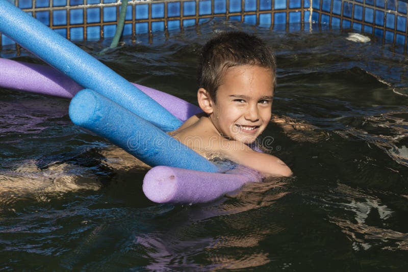 Little Boy in Swimming Pool Stock Image - Image of chemicals, outdoors ...
