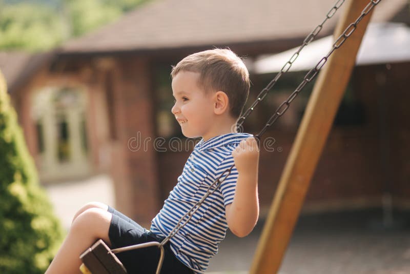 Little Boy on the Swing. Happy Kid Outdoors Stock Photo - Image of home ...