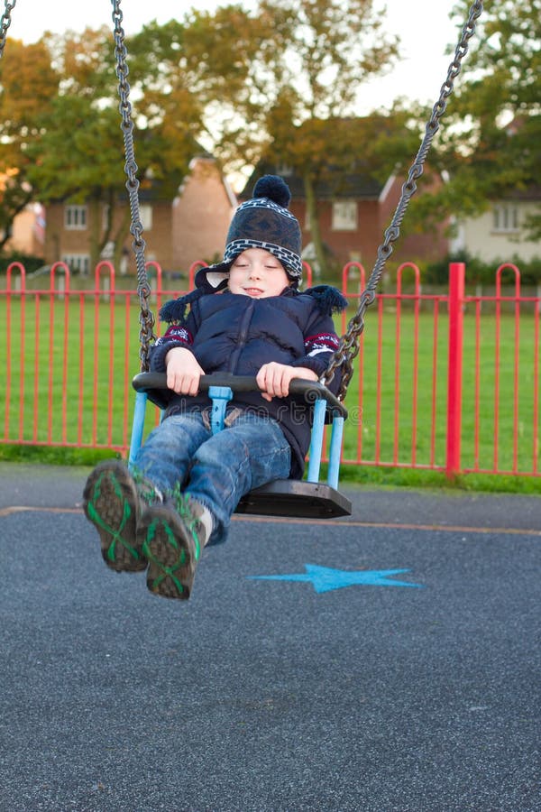 Little Boy on a Swing at the Park Stock Image - Image of portrait ...