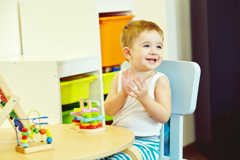 Little Boy at the Table Playing in Developing Game Stock Photo - Image ...