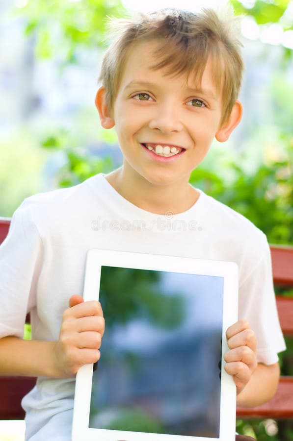 Little boy with tablet stock image. Image of internet - 34224285